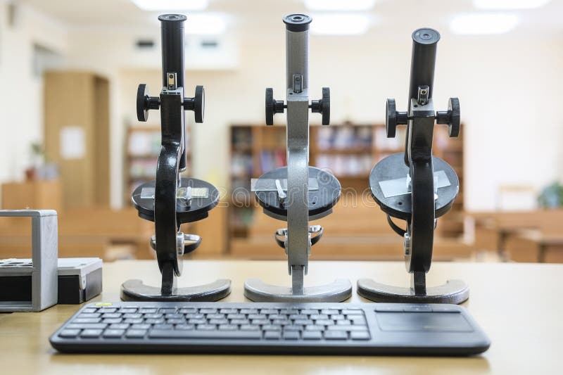 Two microscopes on a desk stock image. Image of instrument - 46915119