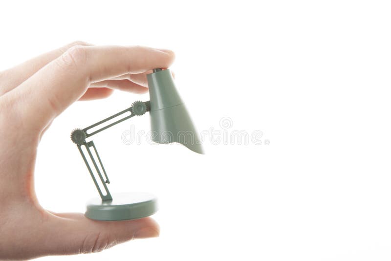 Image of Miniature Lamp Hand White Background Stock Photo - Image of ...