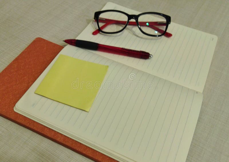 Image of Notebooks Pen Sticky Notes and Glasses Stock Image - Image of ...