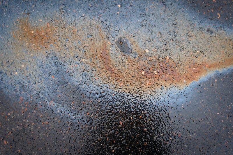 Image of an Oil Stain on the Asphalt of a Wet Road. Stock Photo - Image ...
