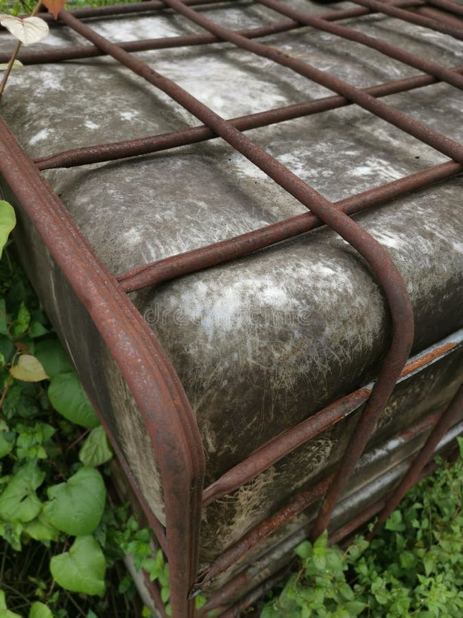 Old HDPE Tank with Rusty Metal Cage Frame Container Stock Image - Image ...