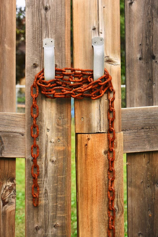 Old Rusted Chain on a Wooden Gate Stock Image - Image of building ...