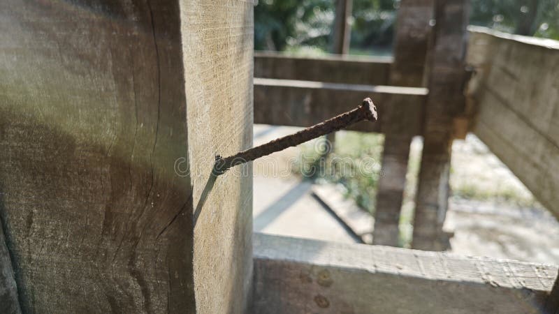 Old Rusty Nail on the Building Weathered Wood Texture. Stock Photo ...