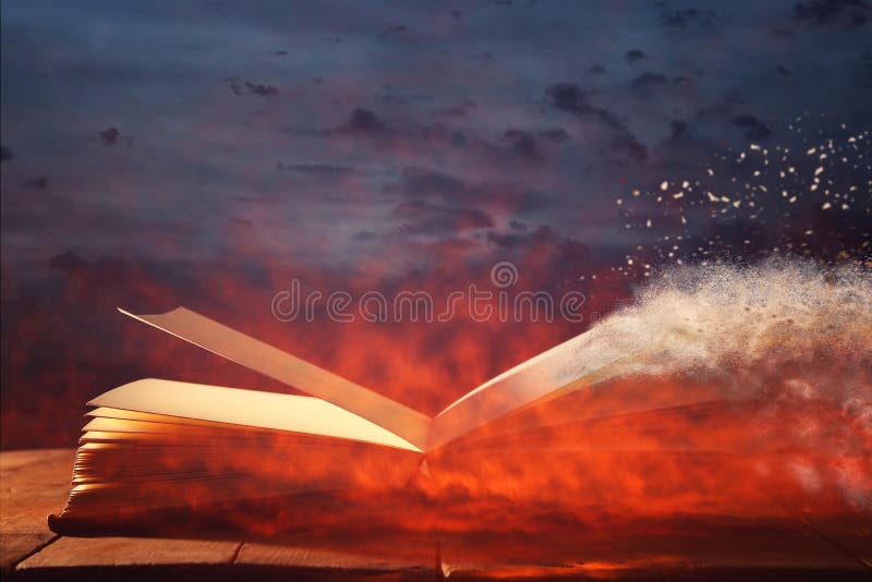 Image of Open Antique Book Over Wooden Table with Flying Pages. Stock ...