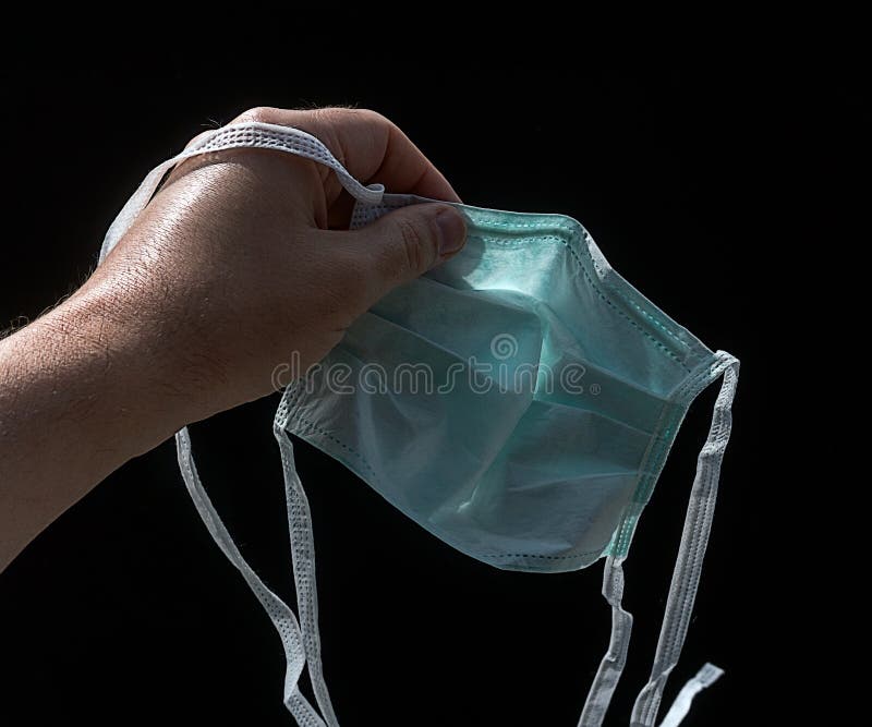 Hand offering a face mask stock photo. Image of hospital - 176607478