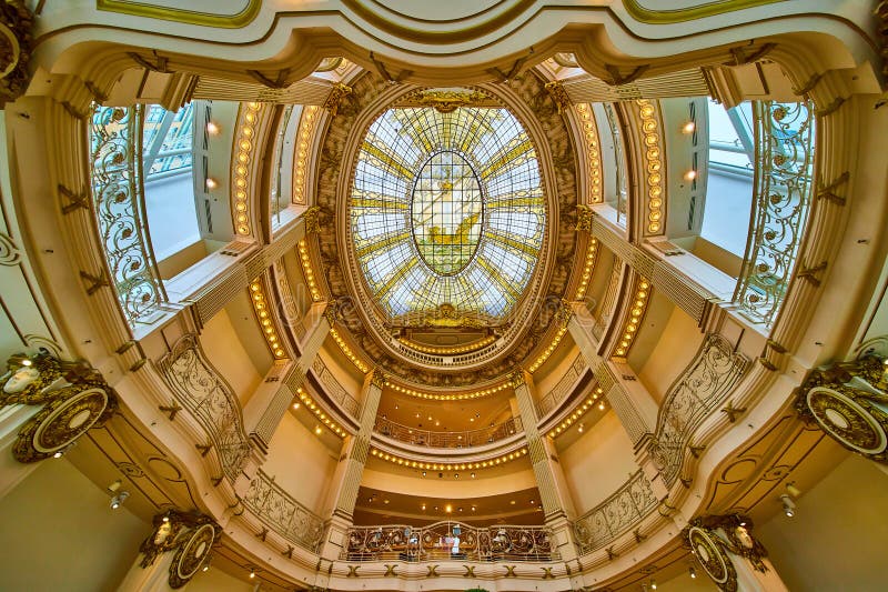 Oval Glass Ceiling with Artwork on Window and Balcony Around Middle ...