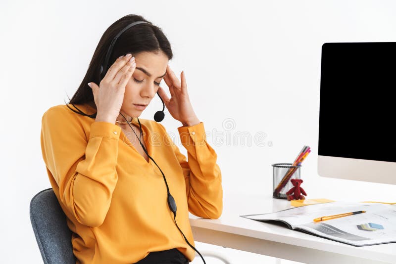 Image of Overworked Woman Wearing Microphone Headset Touching Her Head ...
