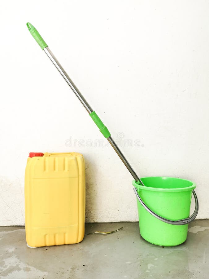 Image of a Pail with Mop and Water Plastic Gallon on the Floor. Stock ...