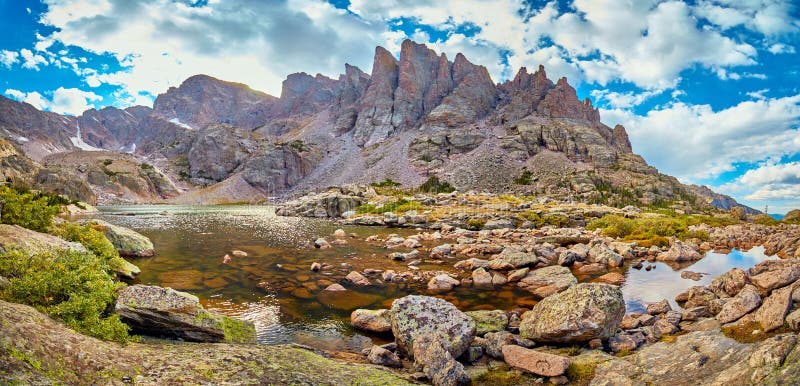 Panorama of Lake at the Top of Mountains with Sharp Peaks Stock Photo ...