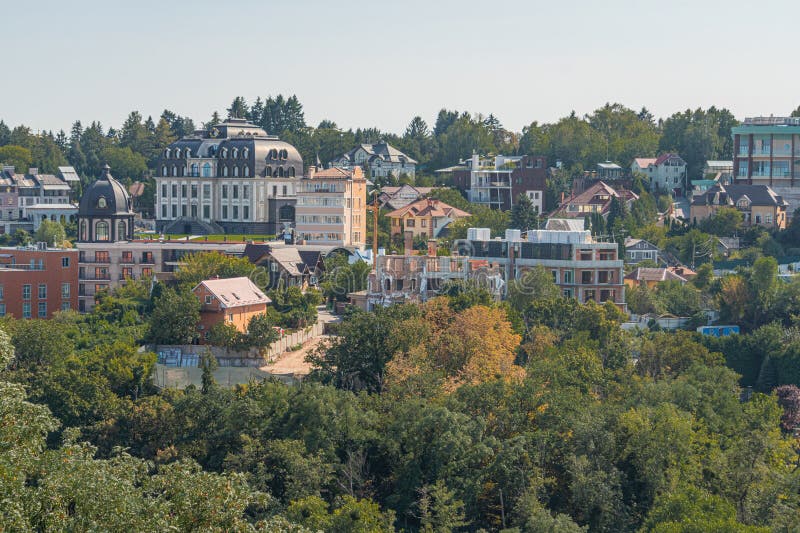 The Image is a Panoramic View of an Urban Area with Lush Green Trees ...