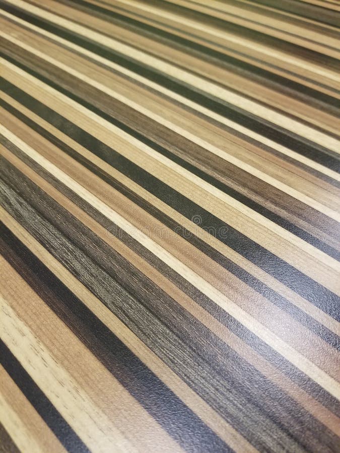 An Image of Parallel Lines of Few Colors Which are Painted on the Table ...