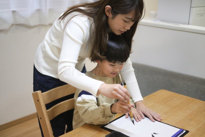 Parents and Children Practicing Calligraphy Stock Image - Image of room ...