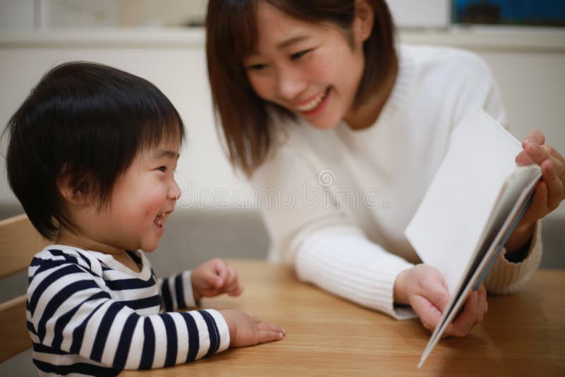Parent and child reading stock photo. Image of person - 241908584