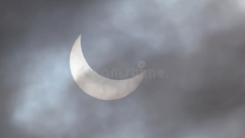 Image of a Partial Solar Eclipse through Veil Clouds Stock Photo ...