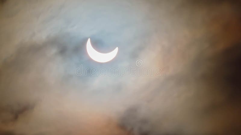 Image of a Partial Solar Eclipse through Veil Clouds Stock Image ...