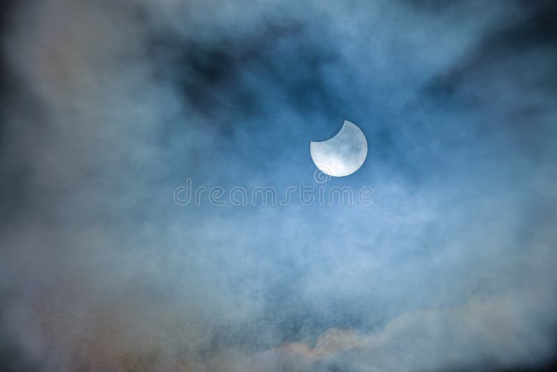 Image of a Partial Solar Eclipse through Veil Clouds Stock Image ...