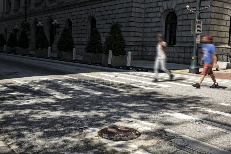 People crossing the road stock photo. Image of blur - 119674888