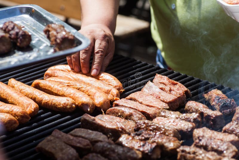 Cooking some meat stock image. Image of food, grill - 124768701