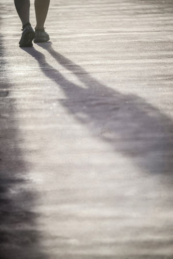 The Image of a Person Walking Alone and the Shadows of Light Stock Photo - Image of exit, male ...