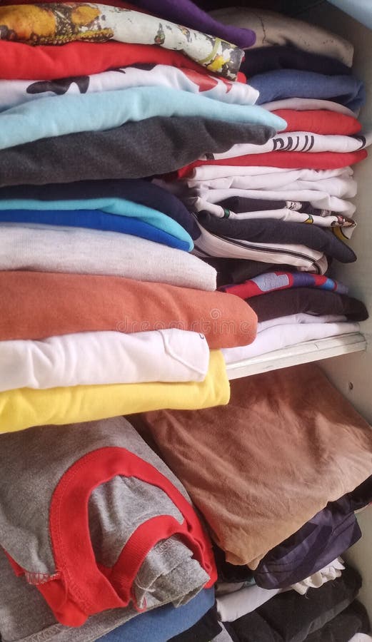 A Pile of Clothes on Fire in Front of a Washing Machine Stock Image ...