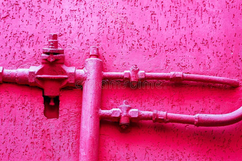 A Pink Wall with Two Pipes Attached To it Stock Image - Image of small ...