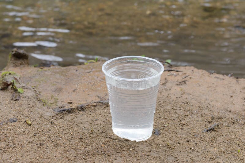 Sand In A Cup Of Water
