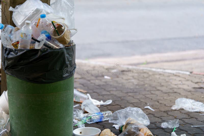 Image of Plastic Trash Filled with Trash that Overflows Outside Stock ...