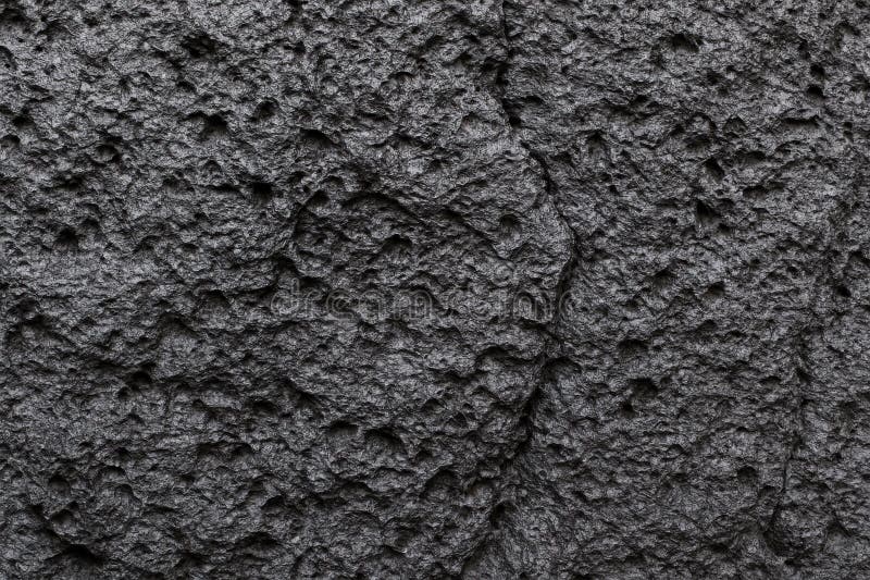 Close-up of Rough Black Lava Rock Surface Showing Porous Texture and ...