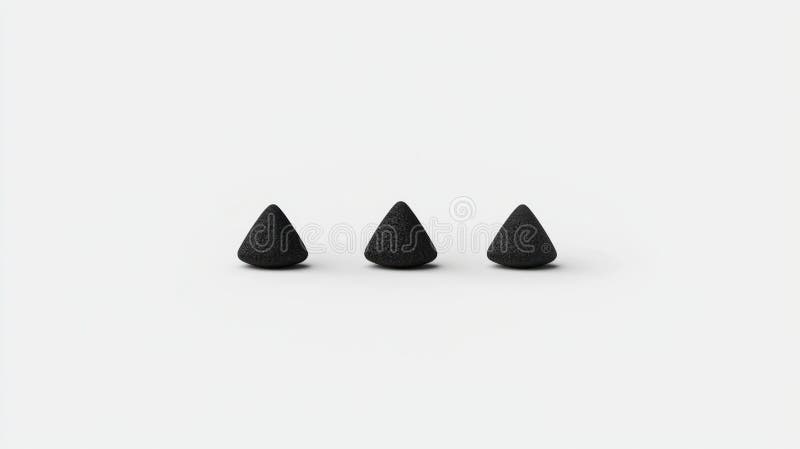 Three Black, Pyramid-shaped Objects Arranged in a Row. Stock Photo ...