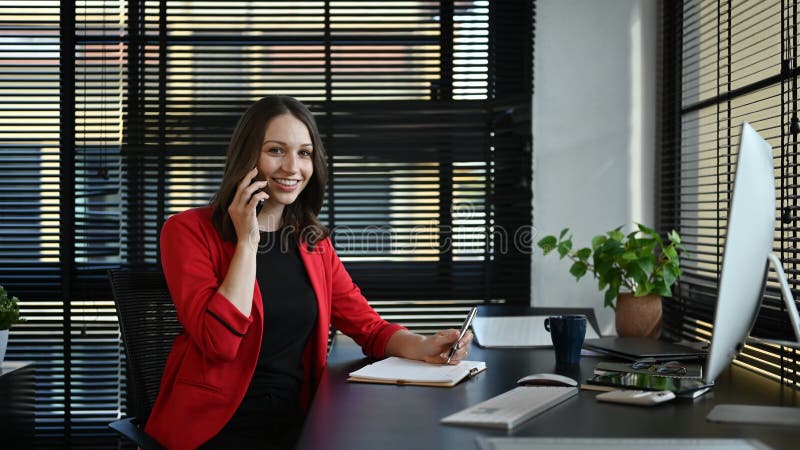 Image of Professional Female Manger in Stylish Suit Sitting Front of ...