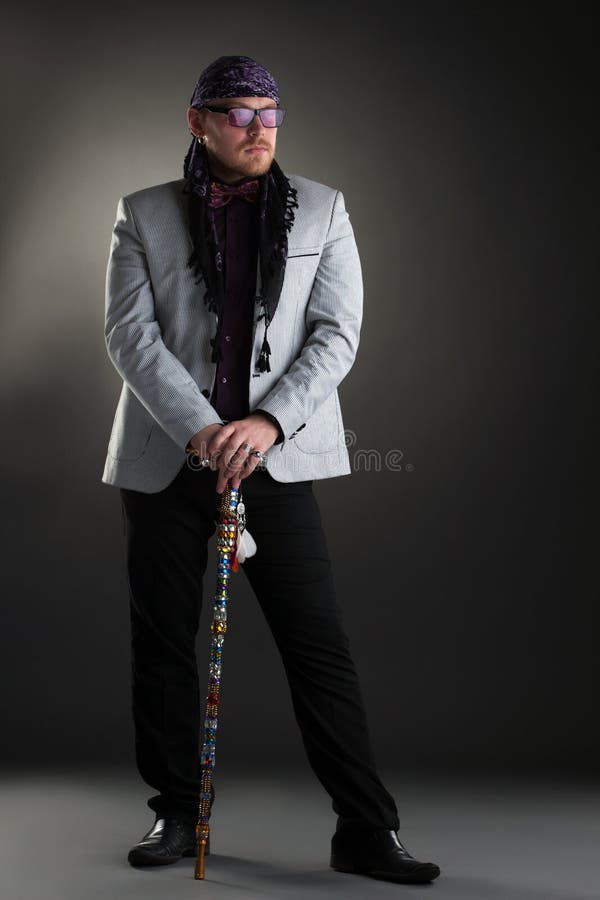 Image of Racy Man Posing with Cane in Studio Stock Photo - Image of ...