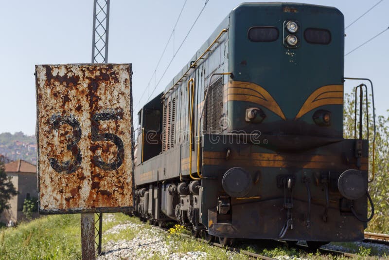 Railroad Sign 35 with Train Passing by Stock Image - Image of sign ...