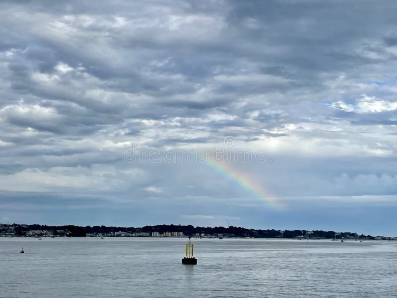 Rainbow and Storm Over the Harbour Stock Photo - Image of ocean ...