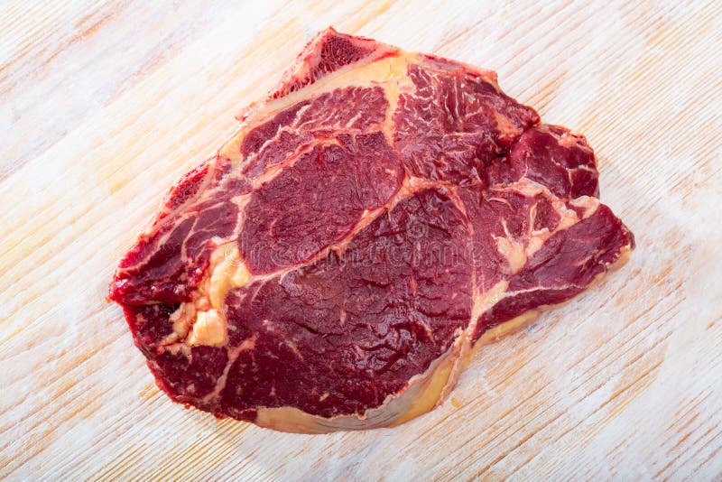 Raw Cow Chop on Natural Wooden Surface, before Cooking Stock Image ...