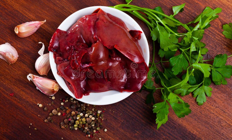 Image of Raw Rabbit Liver with Garlic and Greens Stock Photo - Image of ...