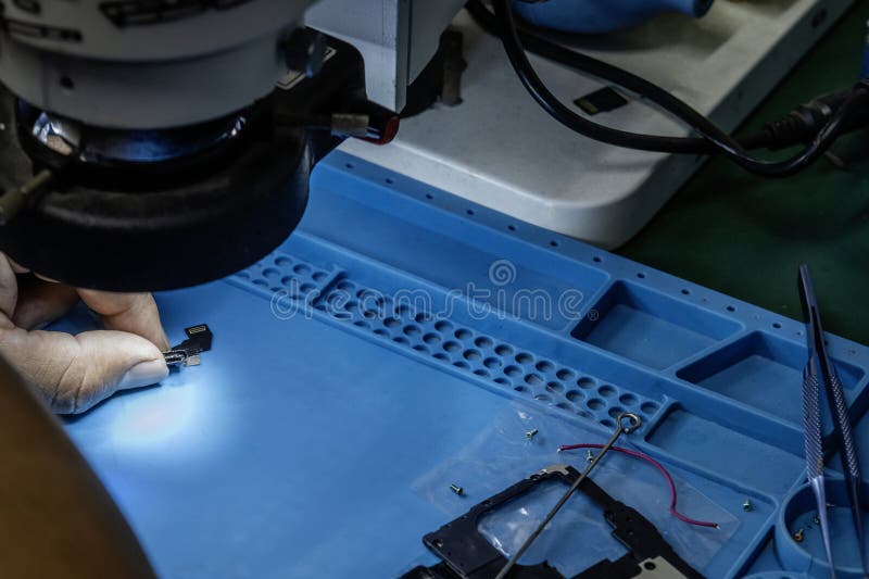 Image of a Repair Technician in an Electronics Store Stock Image ...