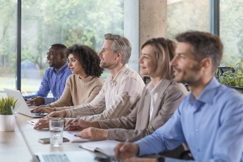 Image of Row of Business People Working at Seminar Stock Image - Image ...