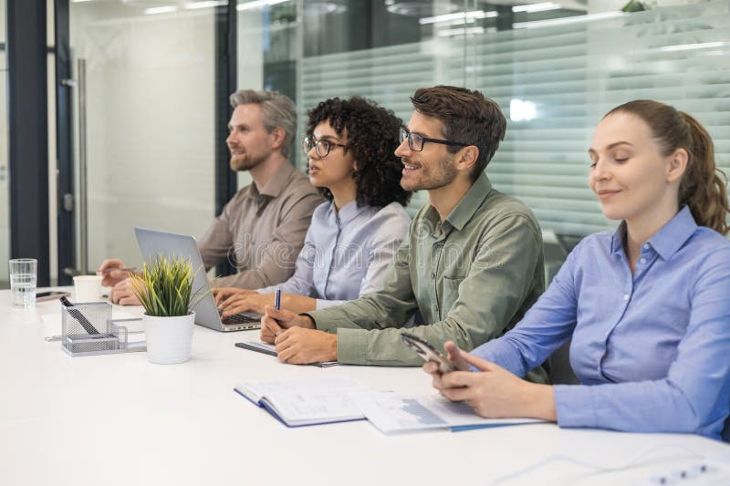 Image of Row of Business People Working at Seminar Stock Photo - Image ...