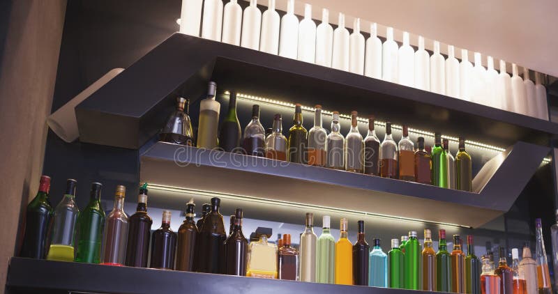 Image of Rows of Bottles on Shelves in Bar Stock Illustration ...