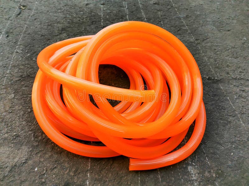 Image of Rubber Hose Coiled on the Ground. Stock Photo - Image of ...