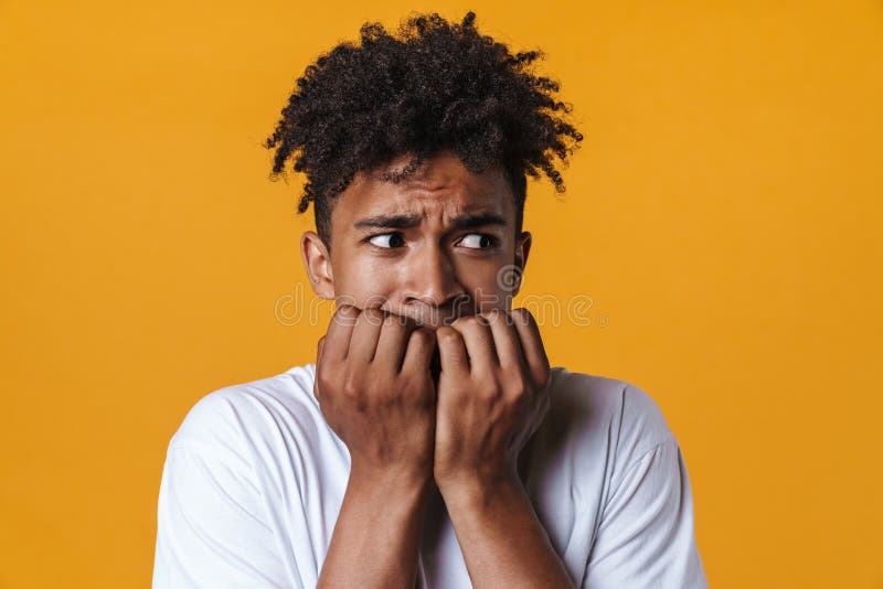 Scared African-American Guy in White Shirt on Light Grey Stock Photo ...