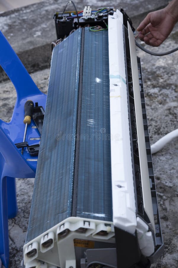 Scene of an Unknown Worker Servicing Disassemble Air-conditioner Parts ...
