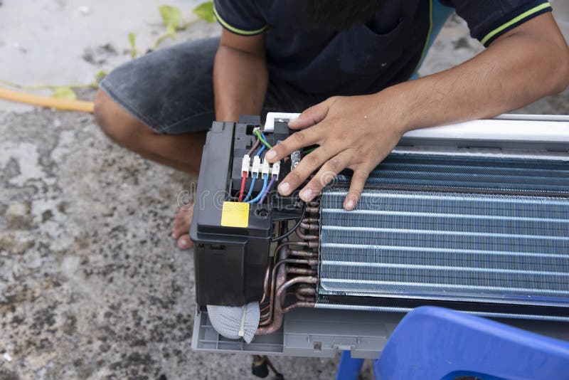Scene of an Unknown Worker Servicing Disassemble Air-conditioner Parts ...