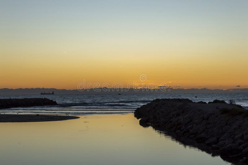 A Image of the Sea at Dawn Next To the Breakwaters Where the River ...