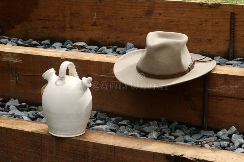 Two Objects Stand Out in the Scene, a Fur Hat and a Water Jug. Stock ...
