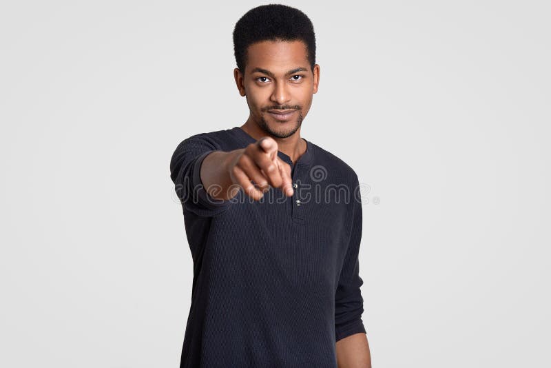 Image of Self Assured Dark Skinned Man Points with Index Finger ...