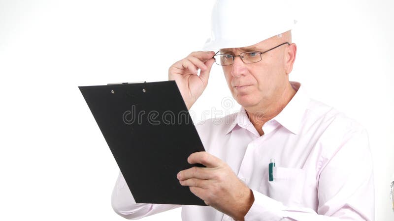 Image with a Serious Engineer Reading Technical Plans Stock Photo ...