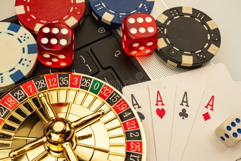 Image Showcases a Casino Setting with Playing Cards, Roulette Wheel ...