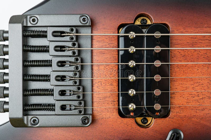 Image Showcases Close-up of an Electric Guitars Bridge and Pickups ...