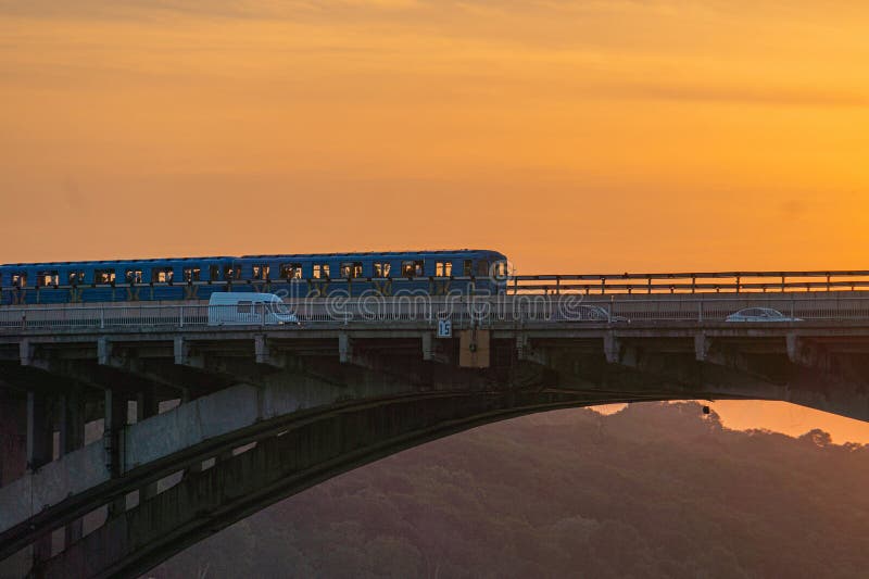 Image Showcases a Long, Concrete Suspension Bridge Over a River or ...